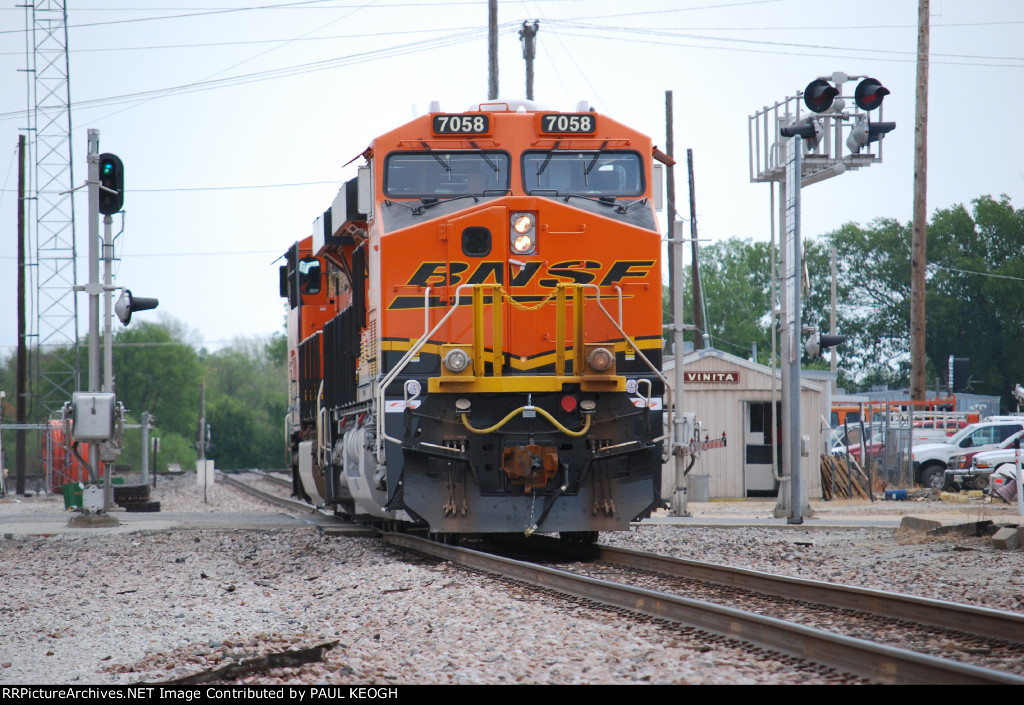With a High Ball Green BNSF 7058 proceeds through the Vinita Intersection and heads east.